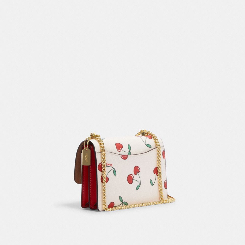 COACH: Bolso cruzado Mini Klare con estampado de corazones de cereza